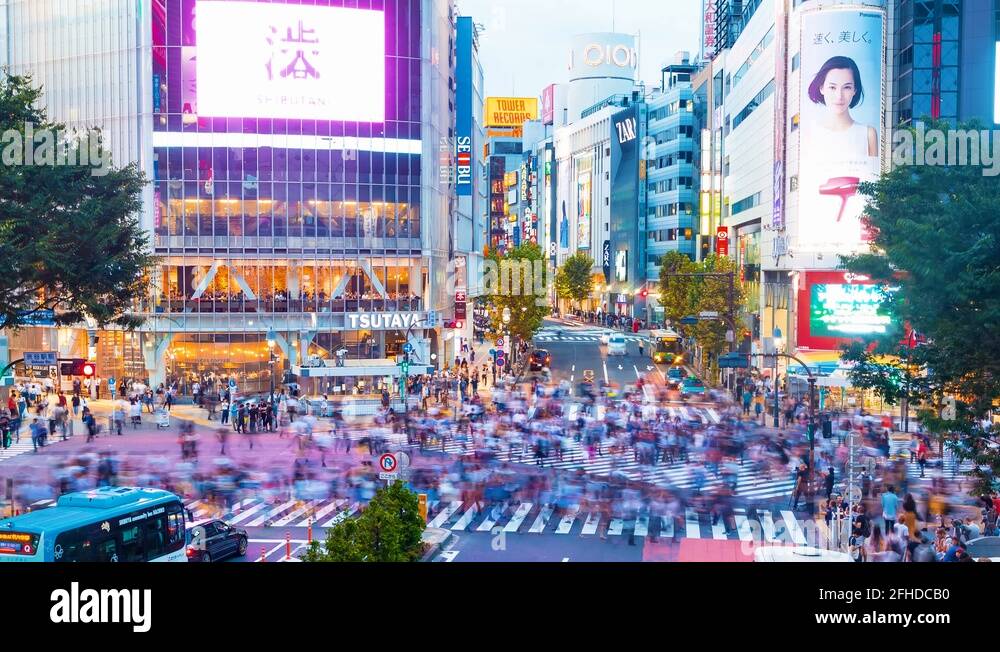 People cross the famous intersection in Shibuya, Tokyo, Japan Stock ...