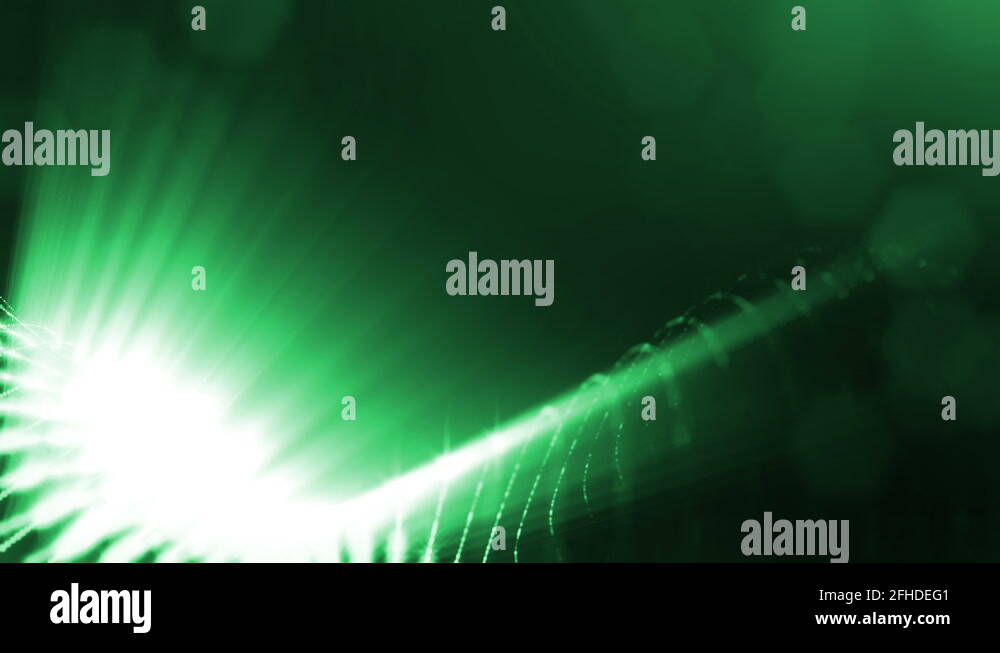 Abstract green background as a loopable sequence with glow particles ...