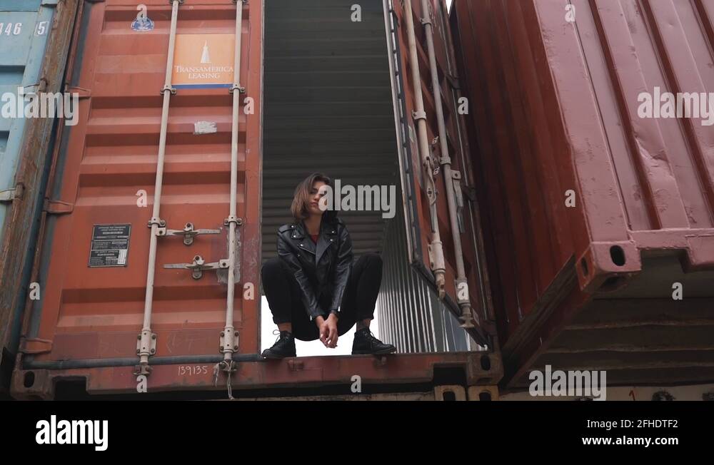 Girl sitting container Stock Videos & Footage - HD and 4K Video Clips ...