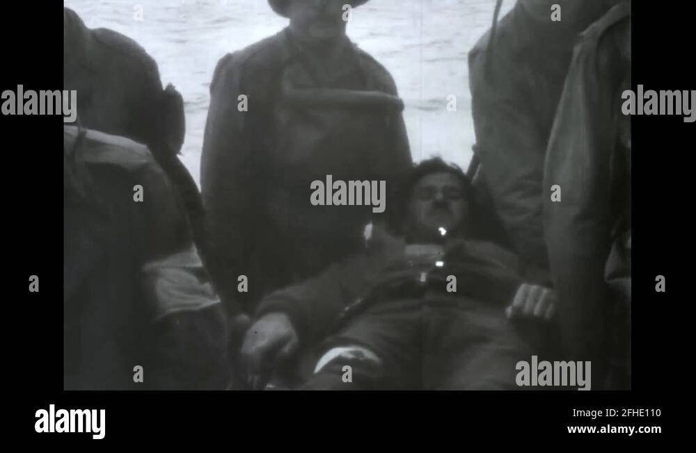 WW2 1944 - Medics carry injured soldier on litter Stock Video Footage ...