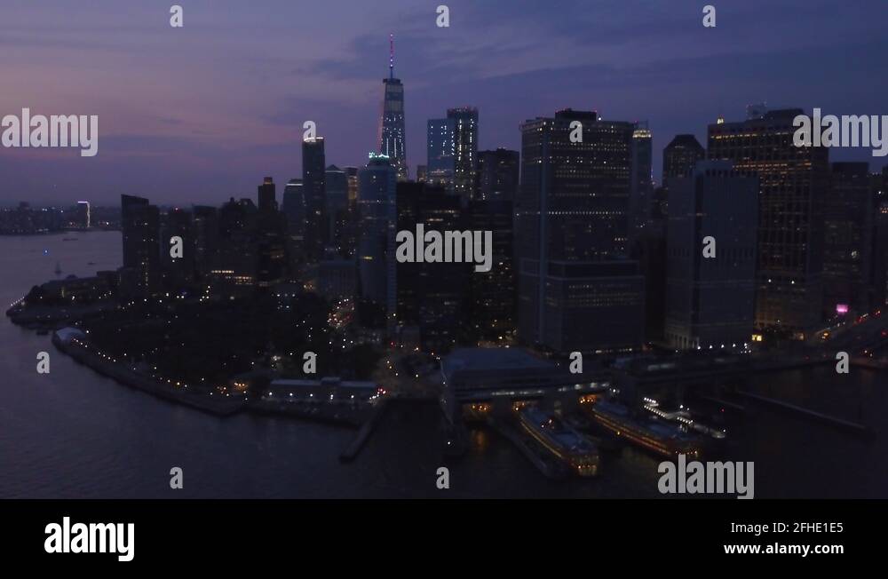 alt dusk flying counter clockwise around downtown Manhattan Stock Video Footage - Alamy