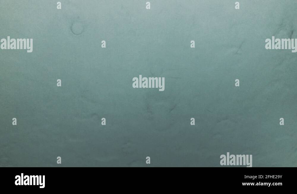 Rain dripping down on glass surface, provoking reflection and self ...