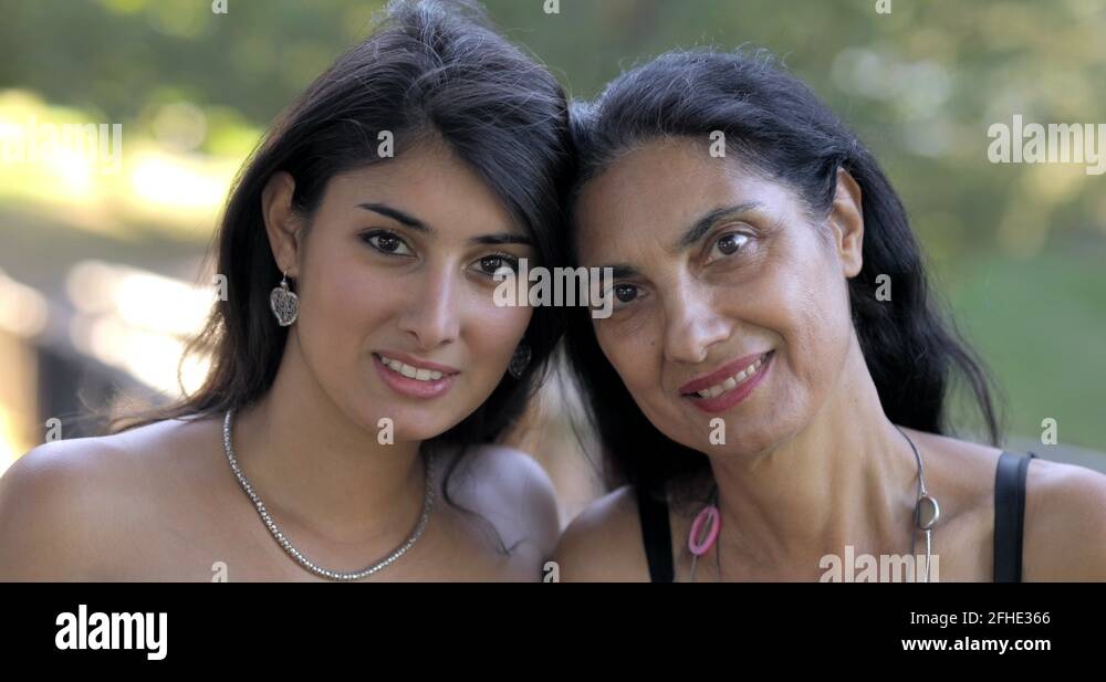 family portrait, generations in comparison. Mother and daughter smiling ...