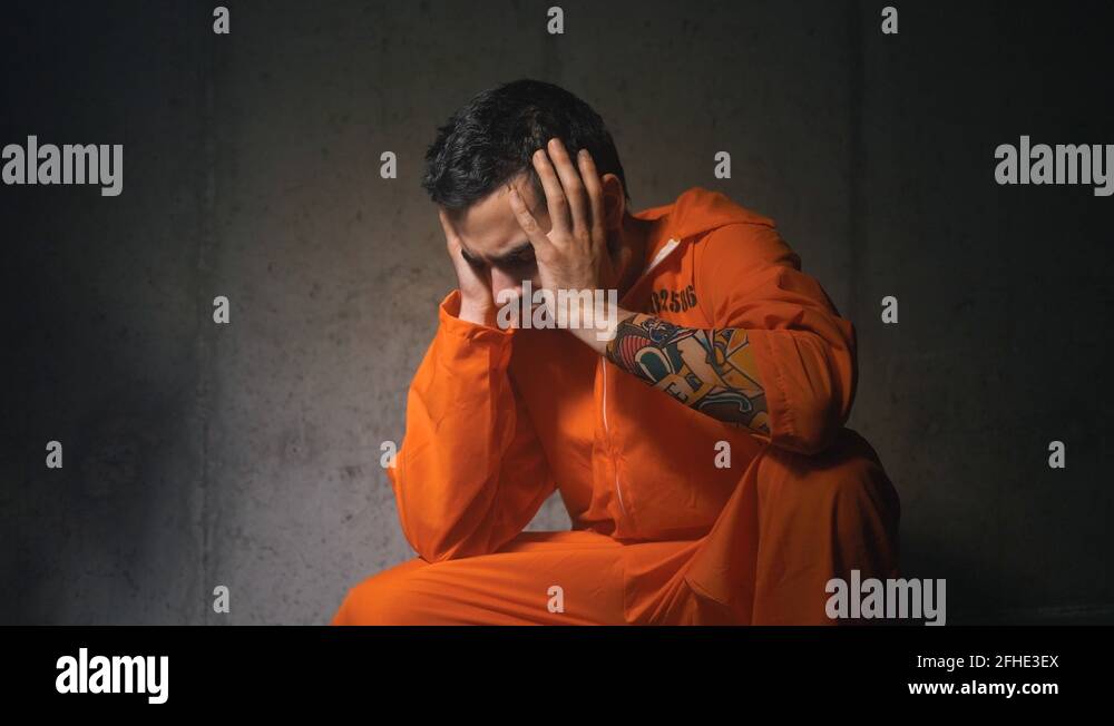 Sad and Stressed Prison Inmate In His Jail Cell Stock Video Footage - Alamy