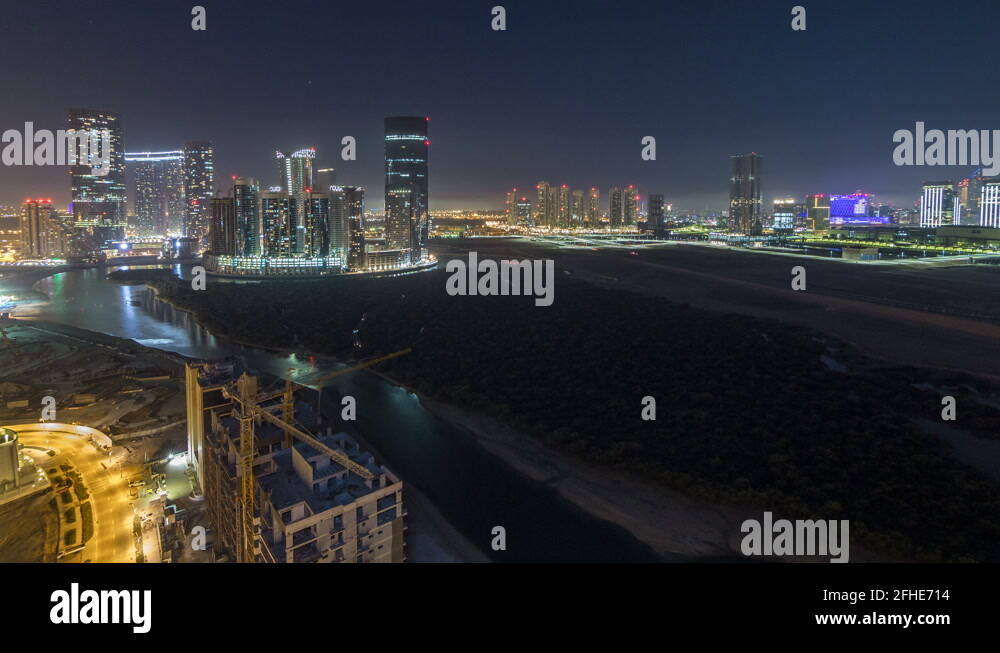 Buildings on Al Reem island in Abu Dhabi night timelapse from above ...