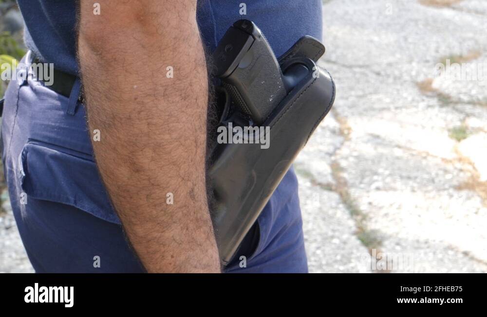 Gun on hip Stock Videos & Footage - HD and 4K Video Clips - Alamy