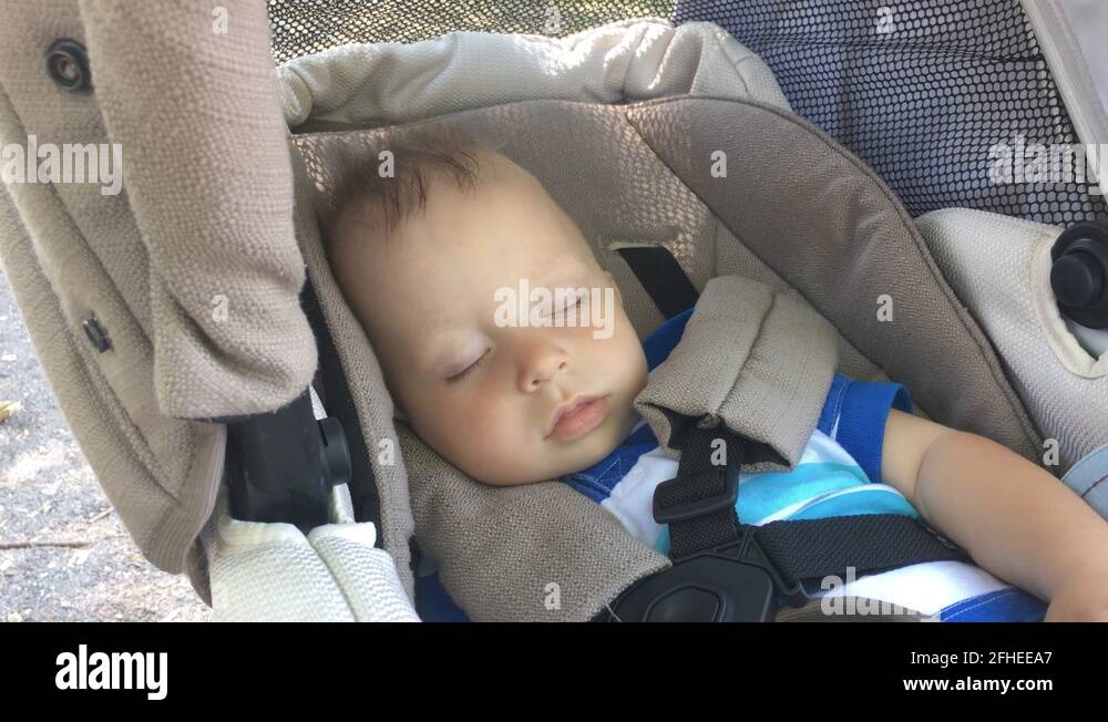 Sleeping in stroller Stock Videos & Footage - HD and 4K Video Clips - Alamy