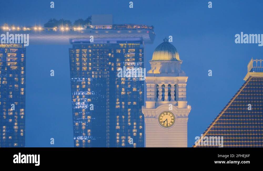 Singapore clock tower at night Stock Video Footage - Alamy