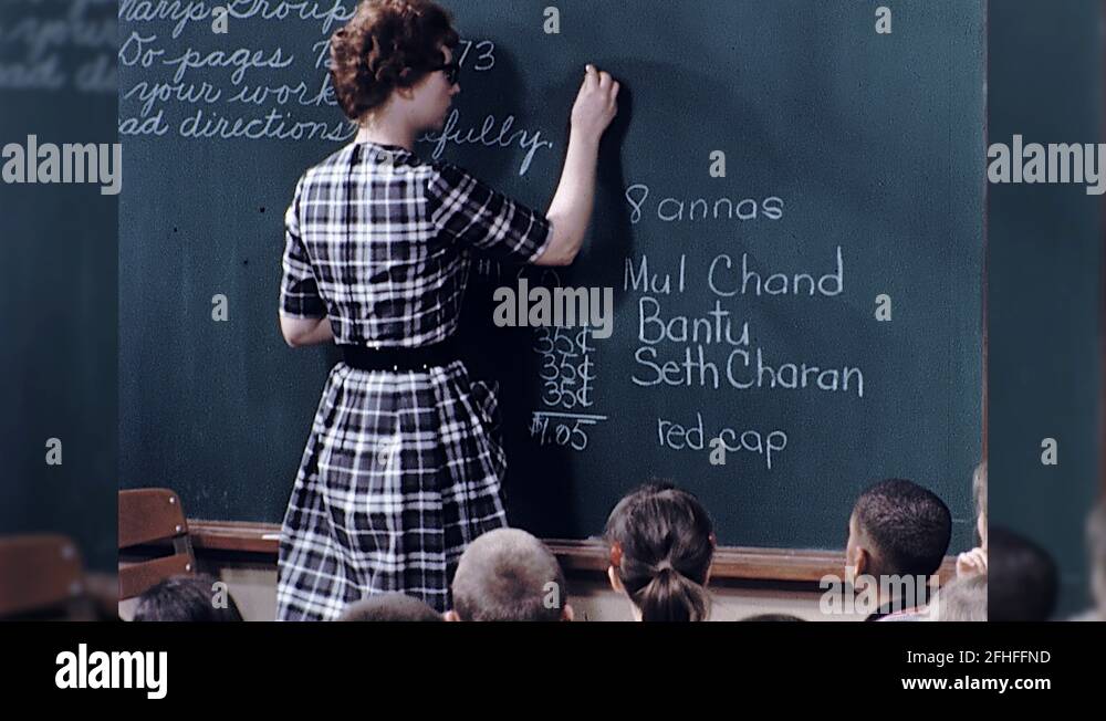 1960s Teacher Writes on Blackboard Students School Classroom Vintage ...