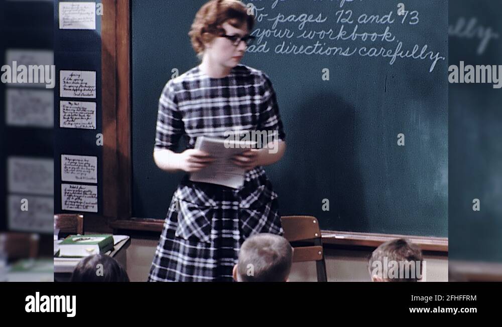 1960s Teacher Writes on Blackboard Students School Classroom Vintage ...