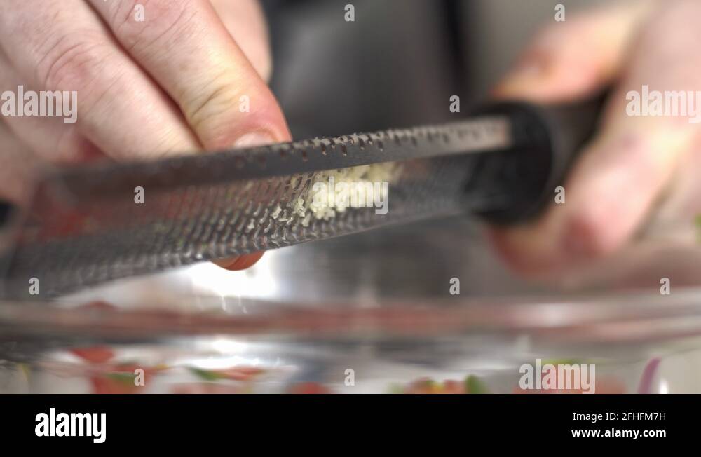 Grating garlic Stock Videos & Footage - HD and 4K Video Clips - Alamy