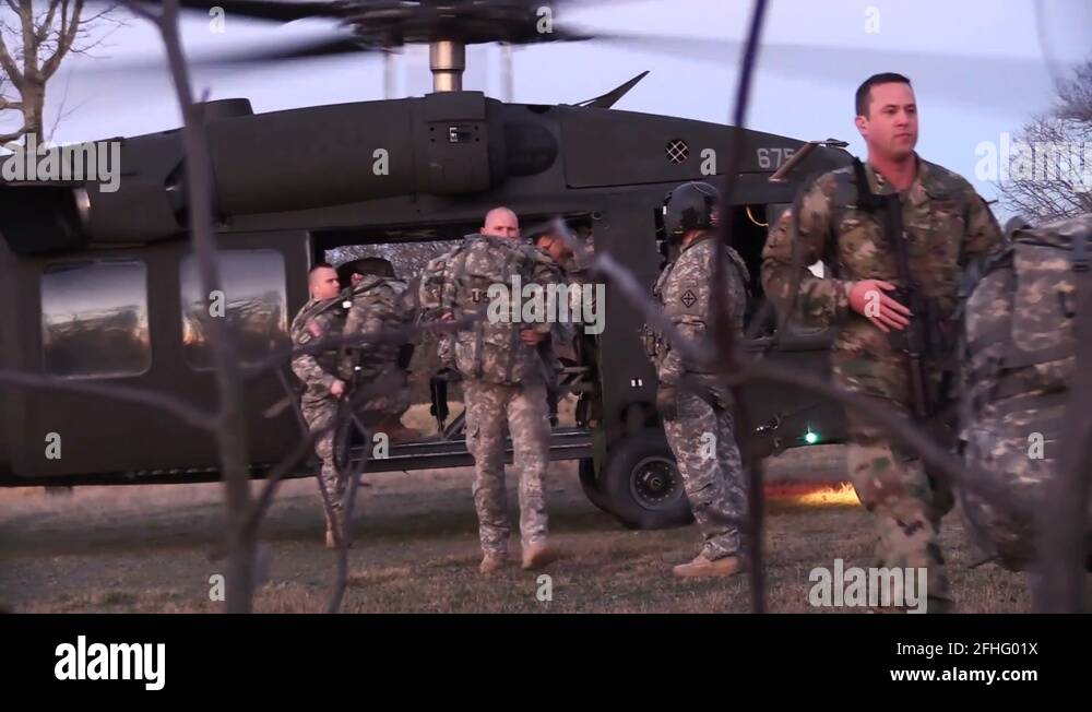 U.S. Military troop soldiers disembark from Black Hawk helicopter ...