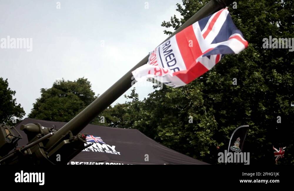 Armed forces day support flag blowing in the wind & hung from large ...