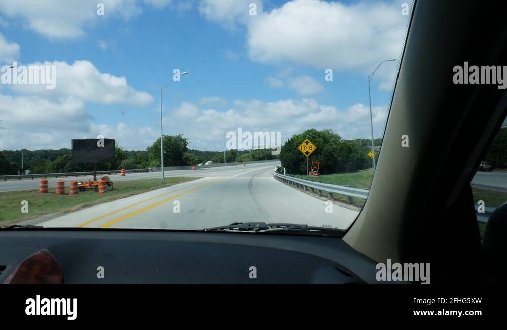 Car entering highway on entrance ramp with road signs above Stock Video ...