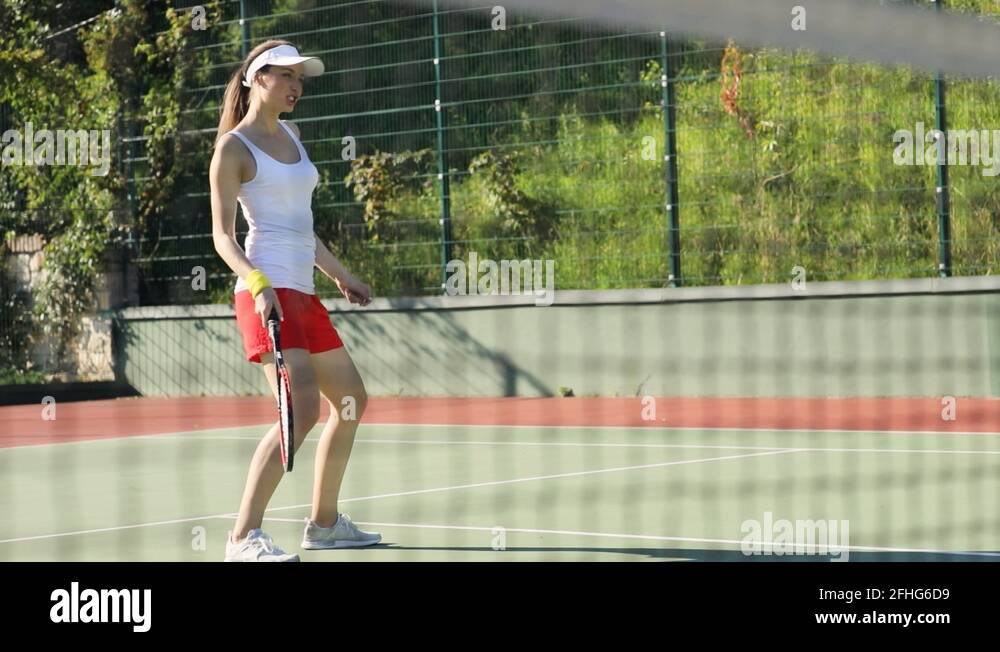 Attractive hot female tennis player dances the winner dance, moves her ...