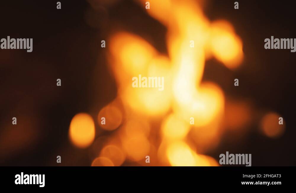 Fire with bokeh appearing then in focus. Fire craclking, fire on wood Stock Video Footage - Alamy