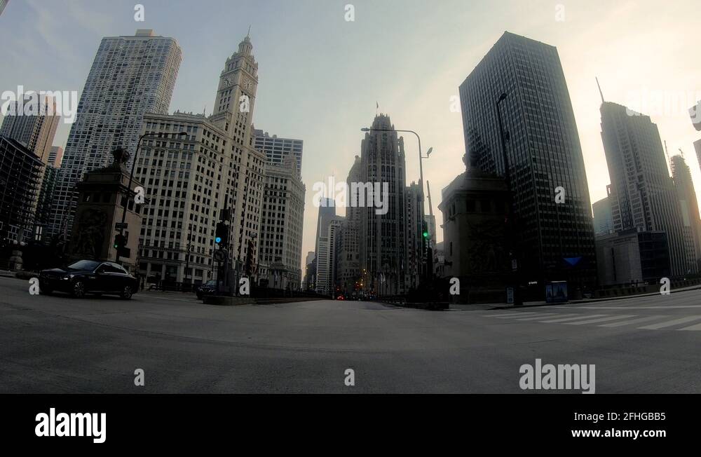 Driving through Chicago downtown past its famous skyline and buildings ...