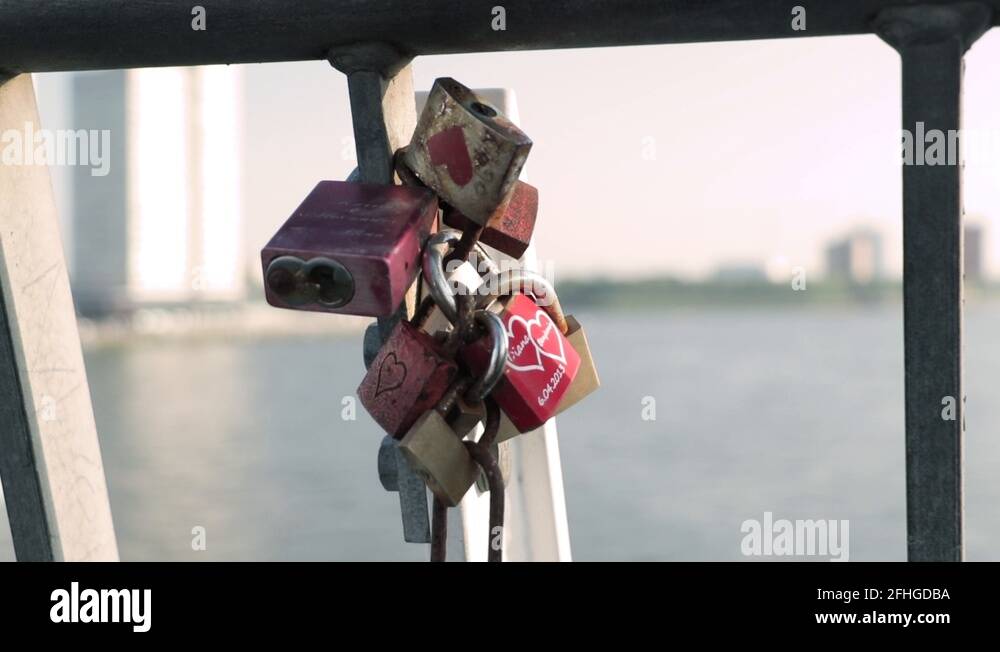Love locks locked in on the railing of the Erasmus bridge of Rotterdam ...