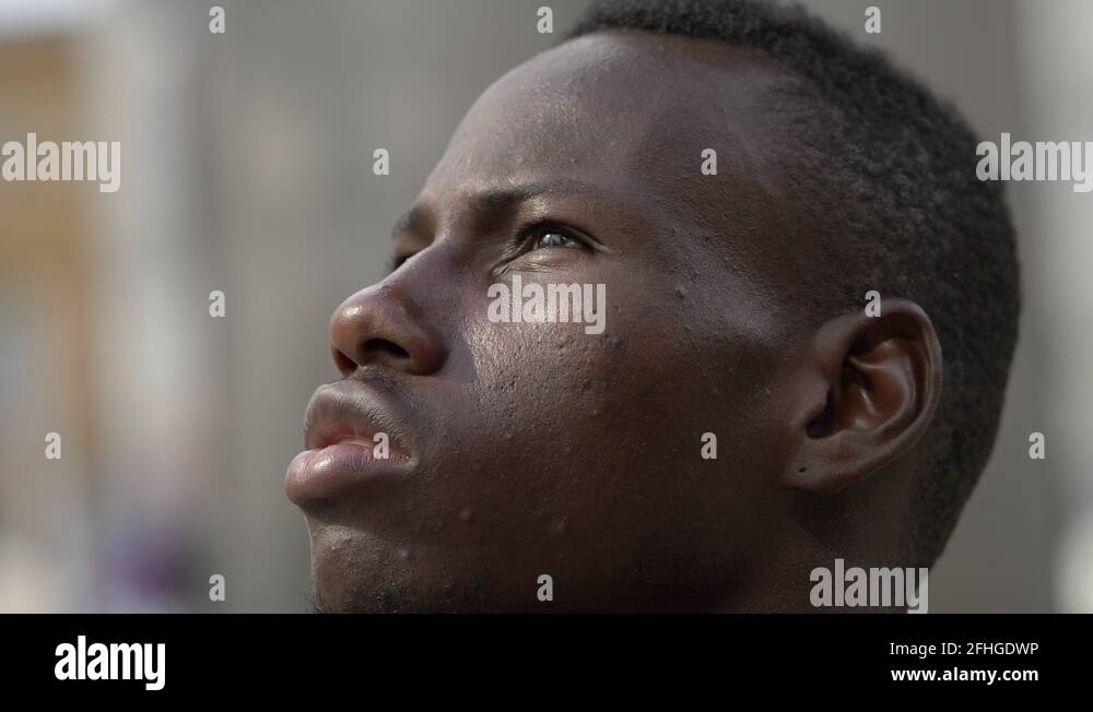 profile of a young African black man looking towards the future. Hope ...