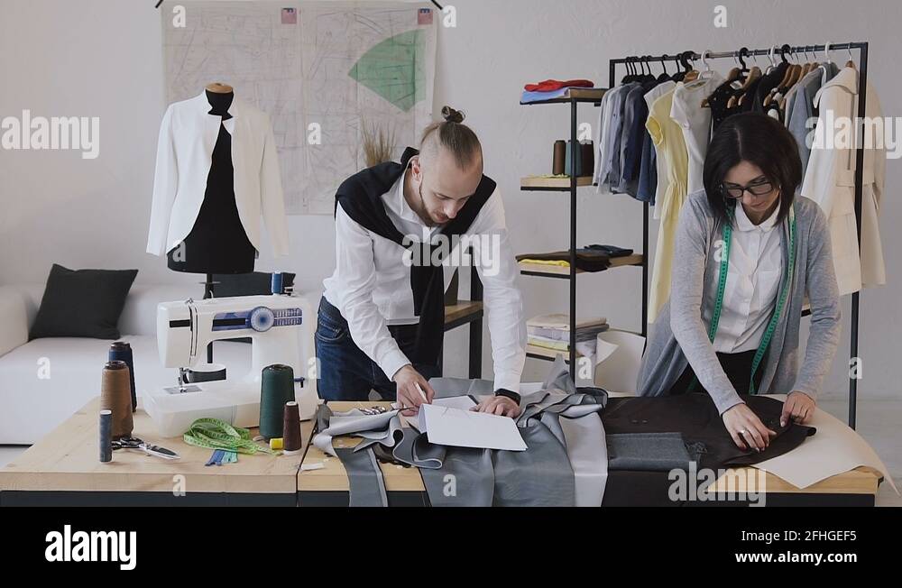 The designer of clothes and dressmaker develops a new collection of ...