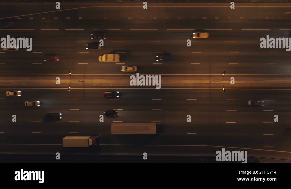Cars on Illuminated Highway in City at Night. Aerial Vertical Top-Down ...