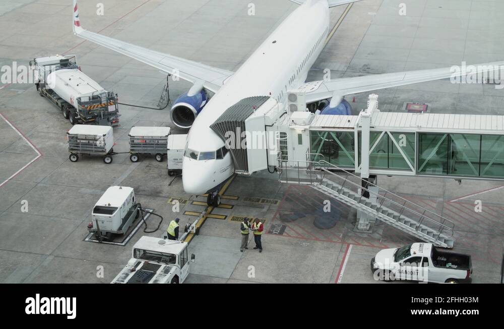 Passengers Disembark Plane at Airport Wide Shot Stock Video Footage - Alamy
