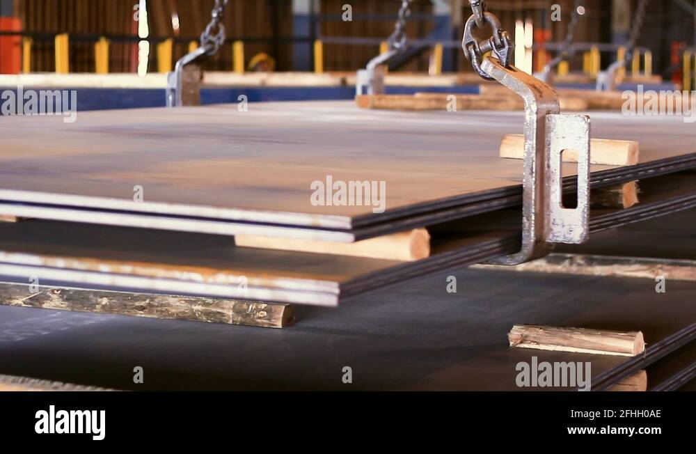 Steel Sheets Lifted by Overhead Crane Stock Video Footage - Alamy