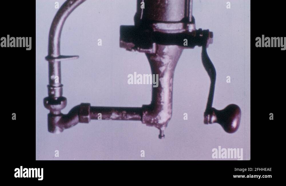 1960s: Orange and blue ball roll through and explore rusted machinery ...