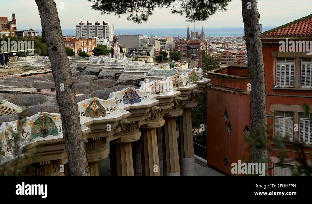 The Gaudi benches at Park Guell overlook the Sagrada Familia in ...