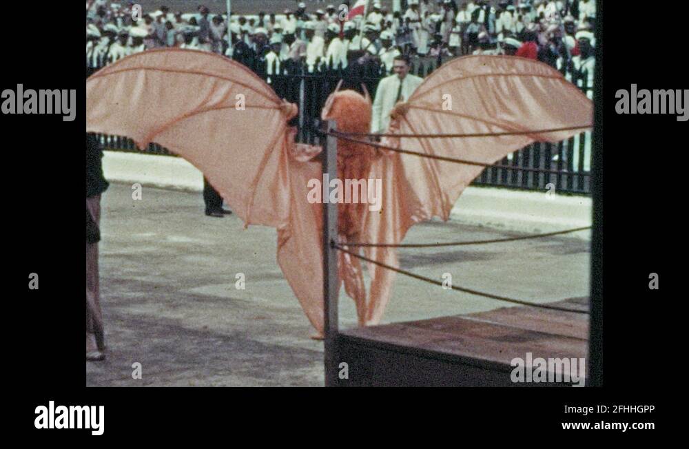 1950s: Performers in bat costumes with large wings dance in front of ...