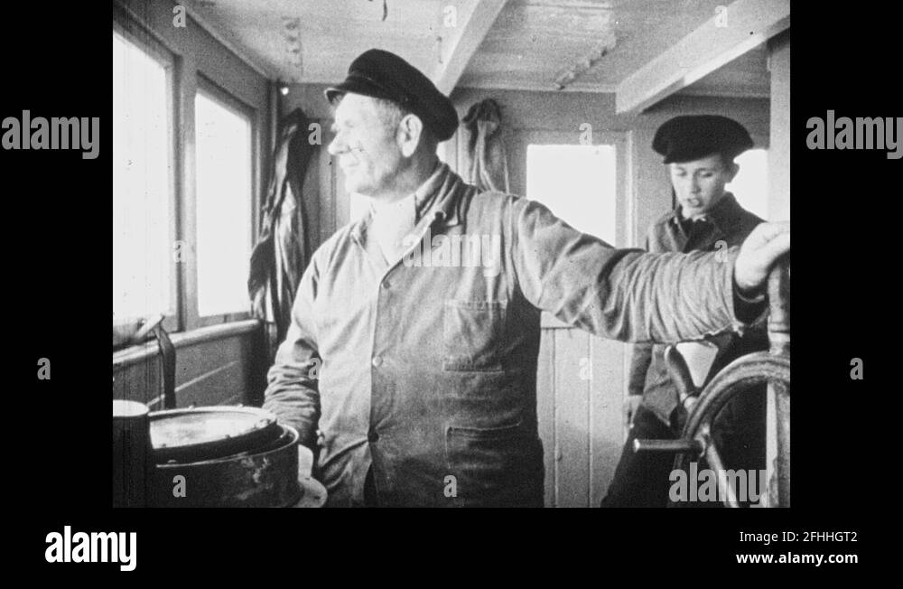 1950s: Ship. Boy brings food to captain. Boy looks out window. Ocean ...