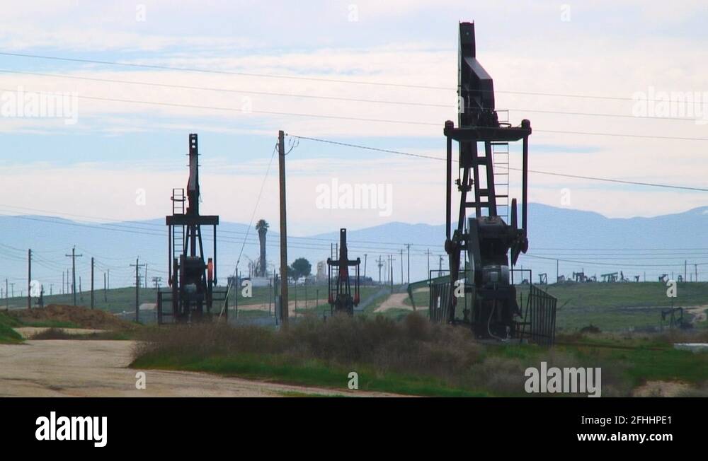 Oil and Gas Industry, Work Of Oil Pump Jack On A Oil Field Stock Video ...