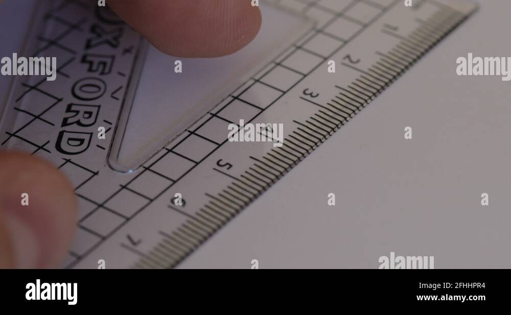 A pencil drawing a line down a ruler Stock Video Footage - Alamy