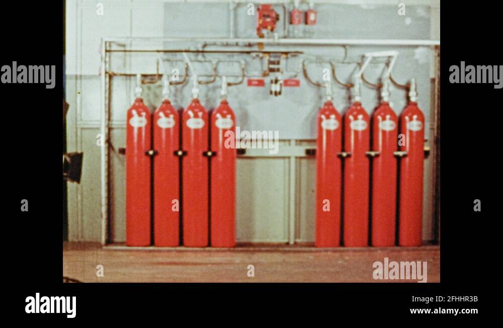 1950s: Row of carbon dioxide canisters hooked up to piping system at ...