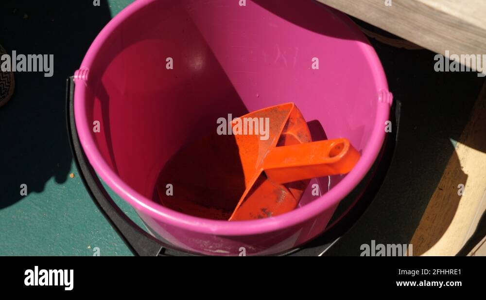 A bucket and a bailing bucket in a boat Stock Video Footage - Alamy