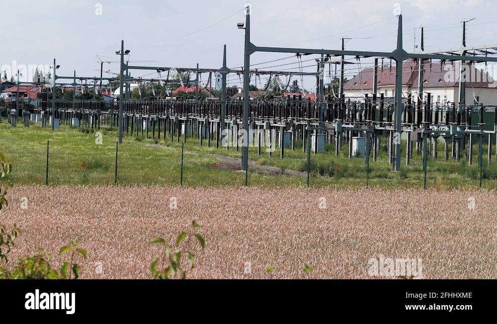 Central power station lines just outside a small city in Germany, wheat ...