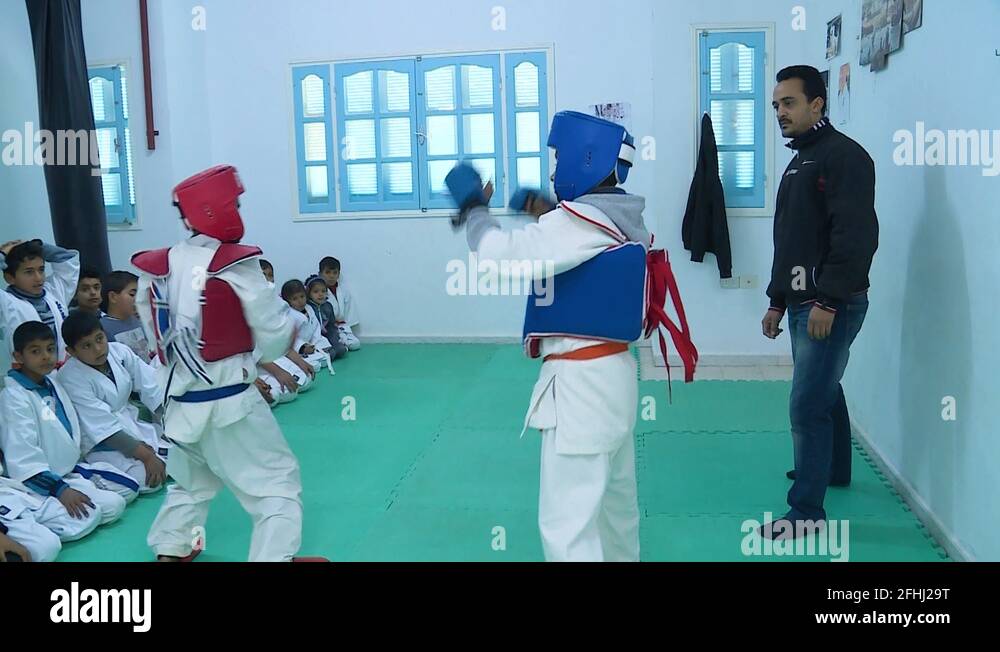 fight between two young Arabic boys learning martial art - small dojo ...