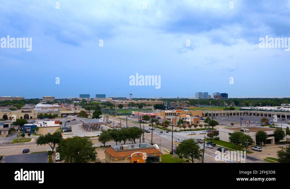 Houston Texas suburban street in 4K with cars driving around as dark ...