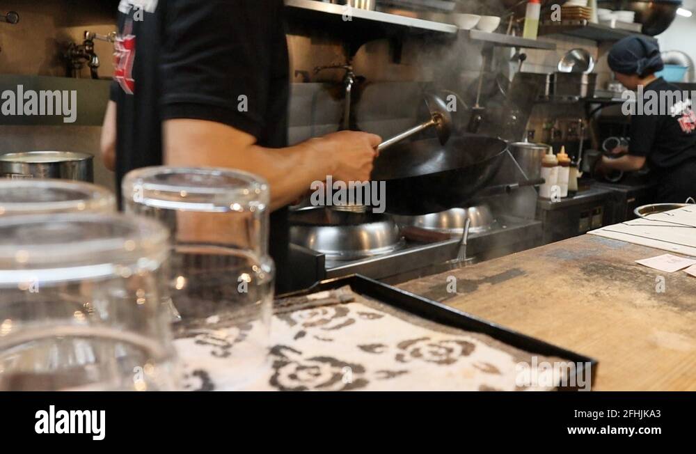Ramen being prepared in a small ramen shop in Shibuya, Tokyo Stock ...