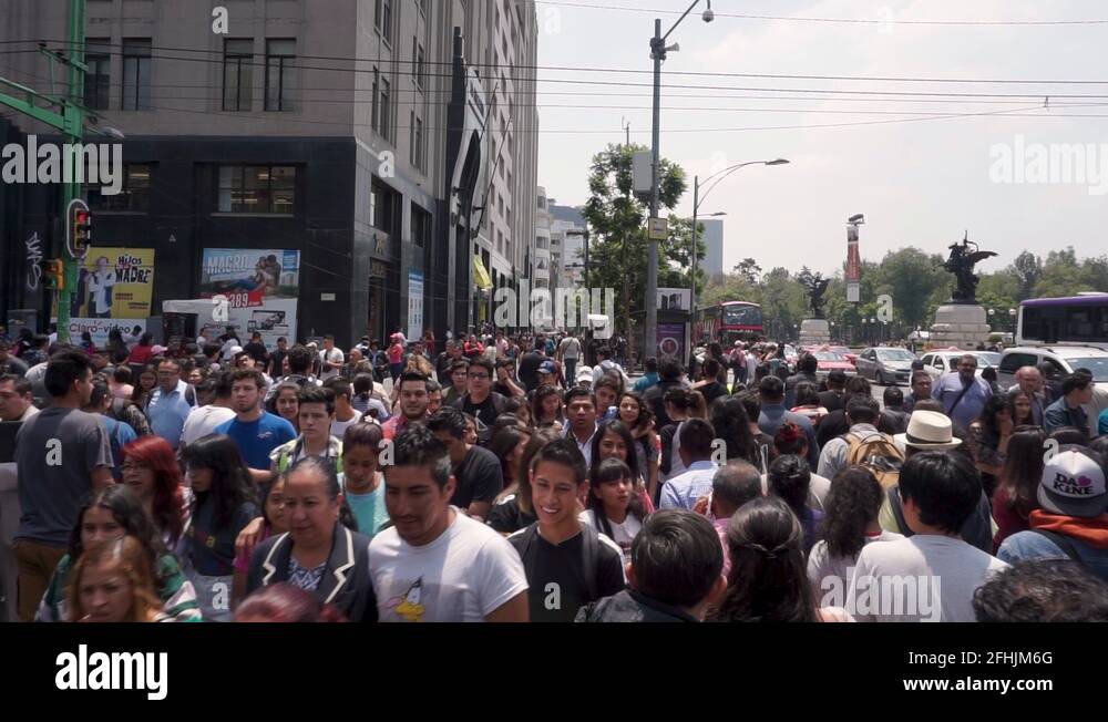 Pedestrians crowd the sidewalks in Mexico City's historic city center ...