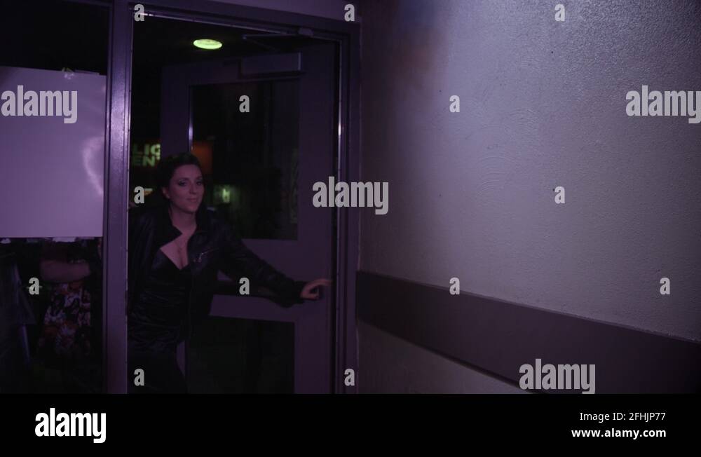 Drunk women arrive to a party giggling and talking. Shot with copyspace ...