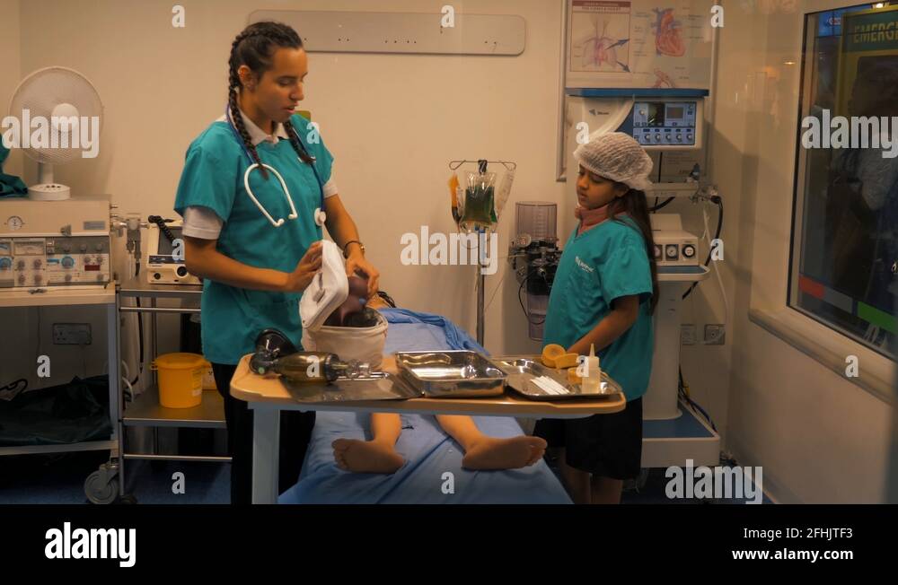 nurse explaining indian child to perform surgery at kidzania in 4k slow ...