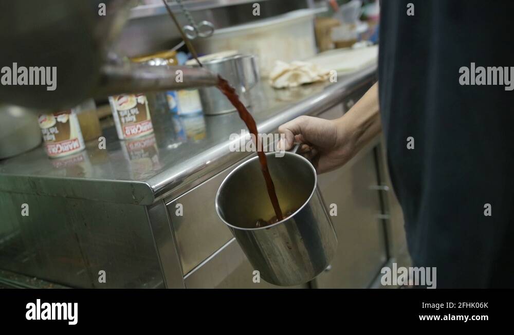 A man making Kopi in Kopitiam, Kopi is a traditional beverages in ...