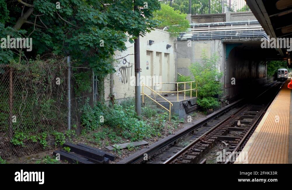 New York MTA subway D train pulling into an outdoor station Stock Video ...