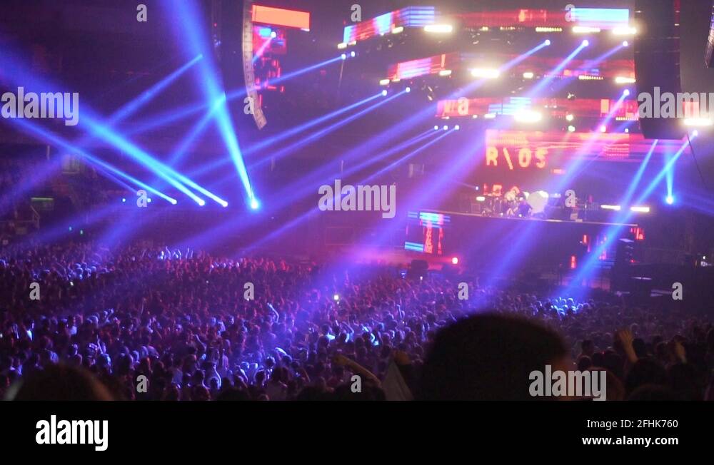 People at concert having fun listening to music and clapping. Shot ...