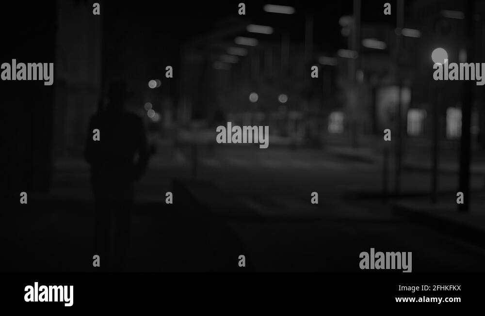 A lonely men walking at night Stock Video Footage - Alamy