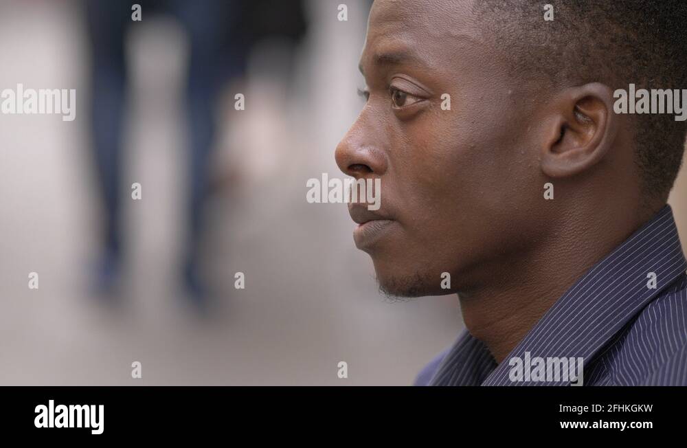 Depressed sad lonely young black african man in the city- profile Stock ...