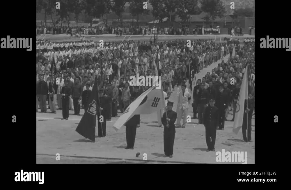 Japanese soldiers and official sings the national anthem - 1947 Stock ...