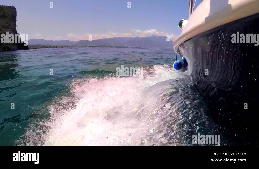 Footage from a boat ride, and filming the water splash up in front of ...