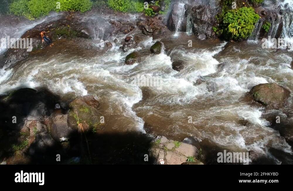 curtain waterfalls with river in the bottom. we caught a rainbow as we ...